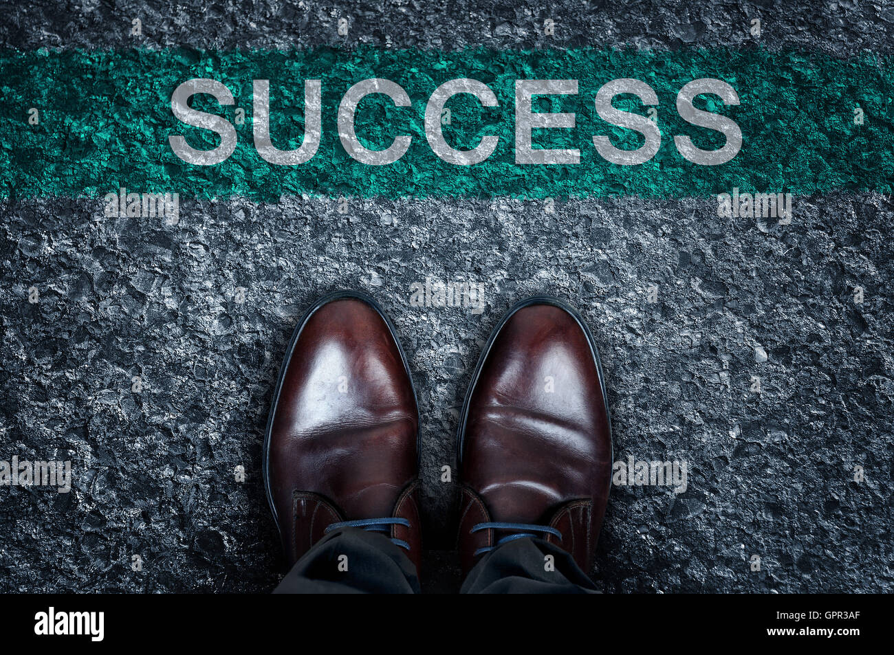 Success message on asphalt and business shoes Stock Photo - Alamy