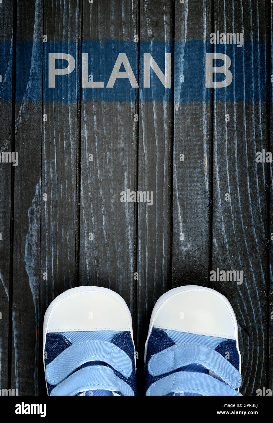 Plan B message and kid shoes on wooden floor Stock Photo - Alamy