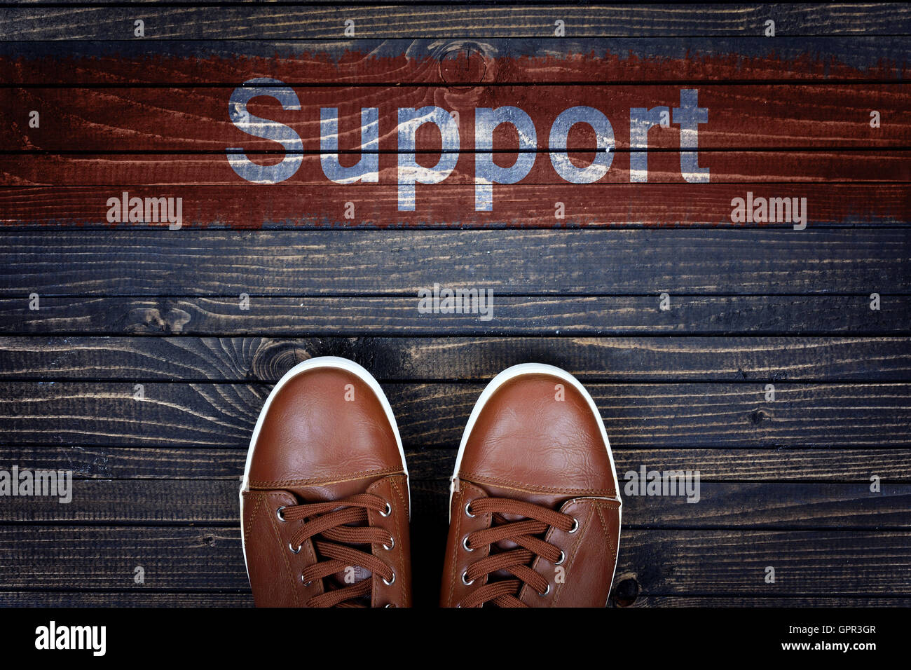 Support message and sport shoes on wooden floor Stock Photo - Alamy