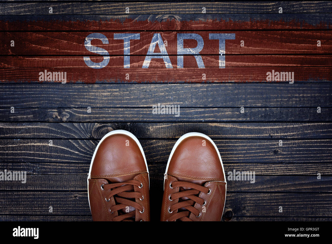 Start message and sport shoes on wooden floor Stock Photo - Alamy