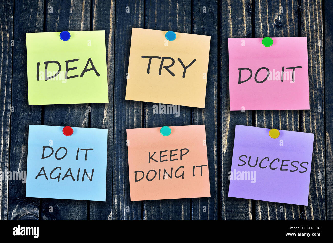 Success determination message on stickers post on wooden wall Stock ...
