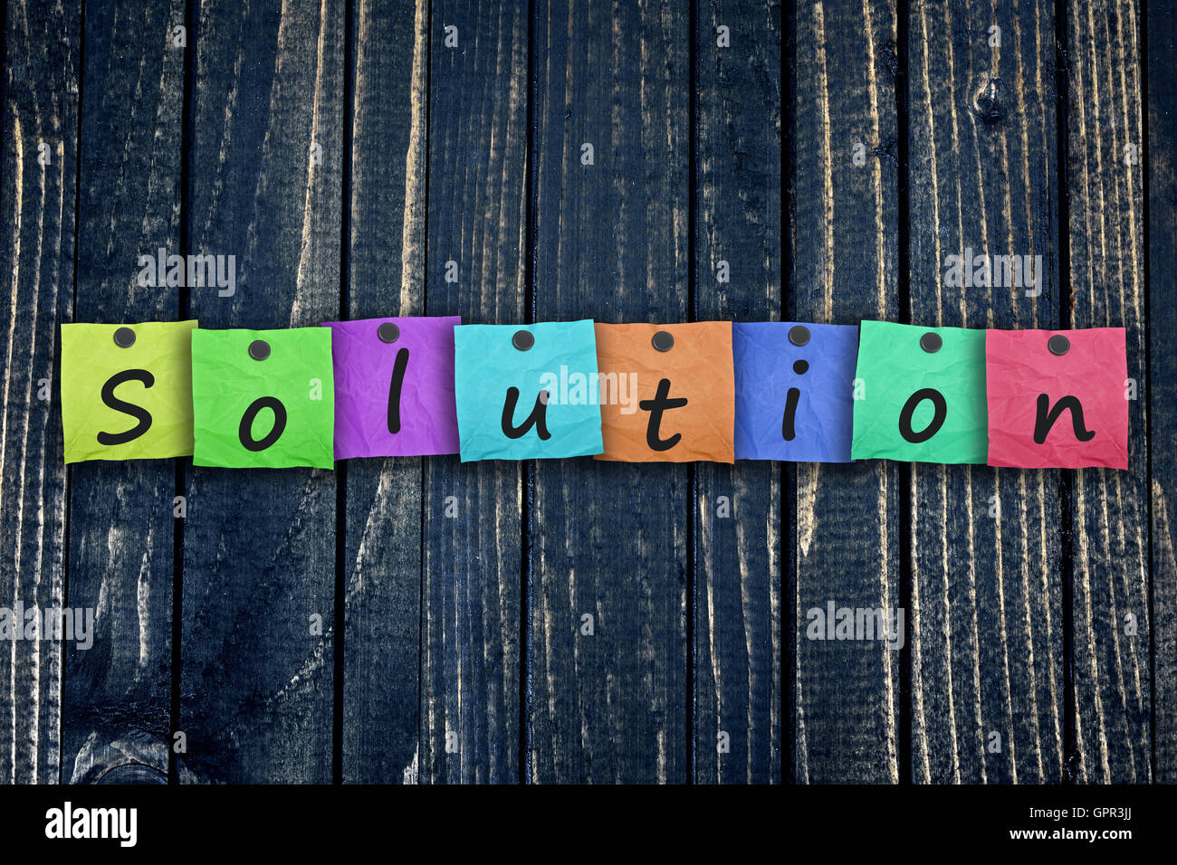 Solution message post on wooden wall close-up Stock Photo - Alamy
