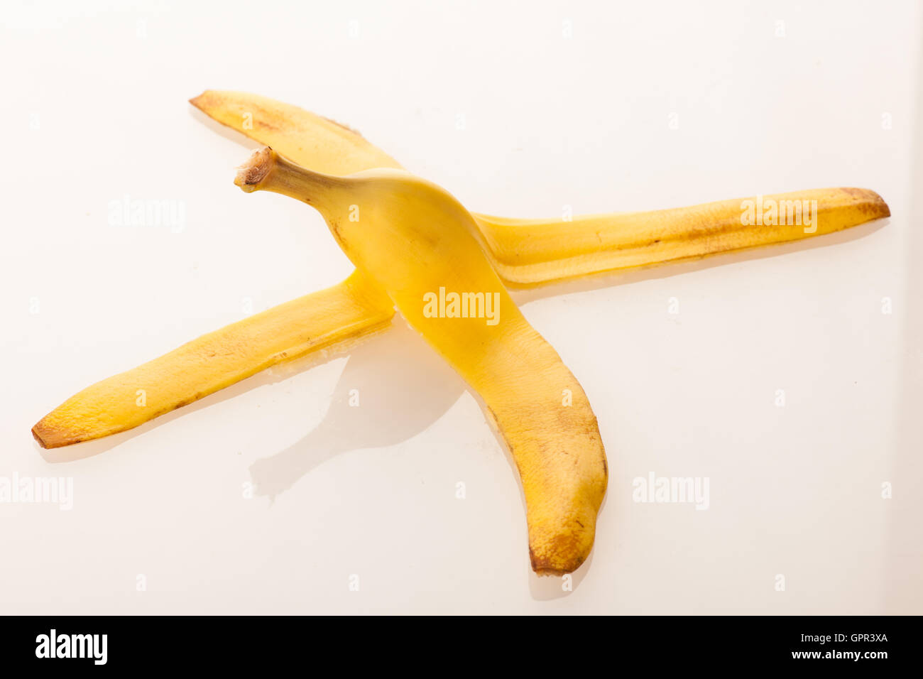 banana skin on a white background Stock Photo - Alamy