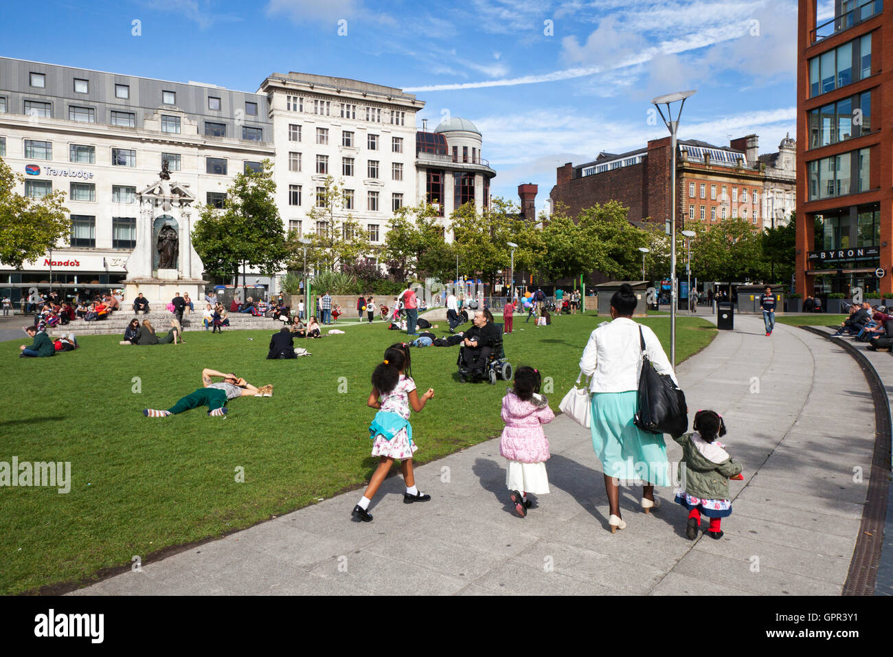 People in Manchester Piccadilly Gardens, an urban green oasis in the ...