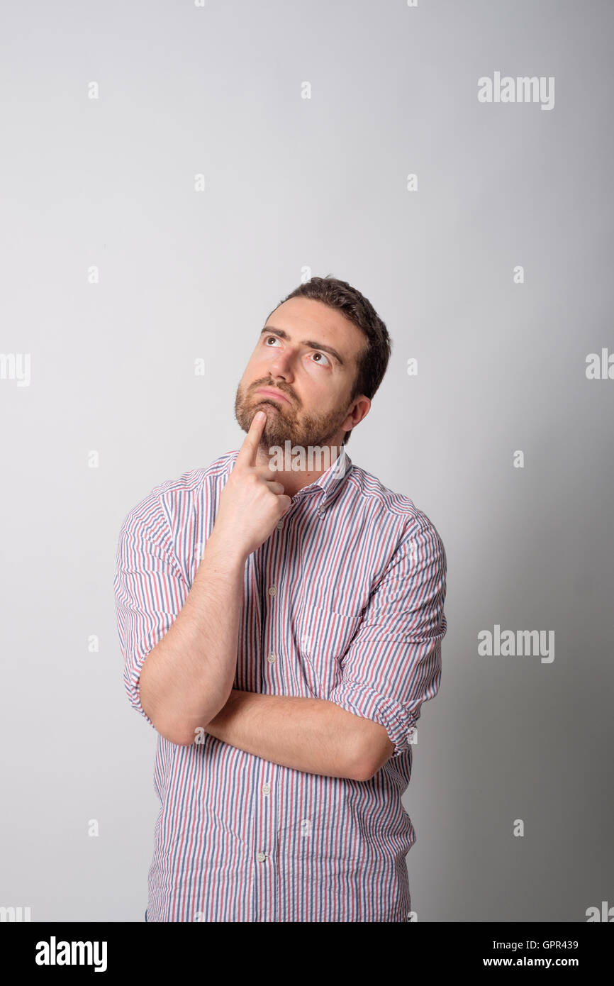 Doubtful expression hi-res stock photography and images - Alamy