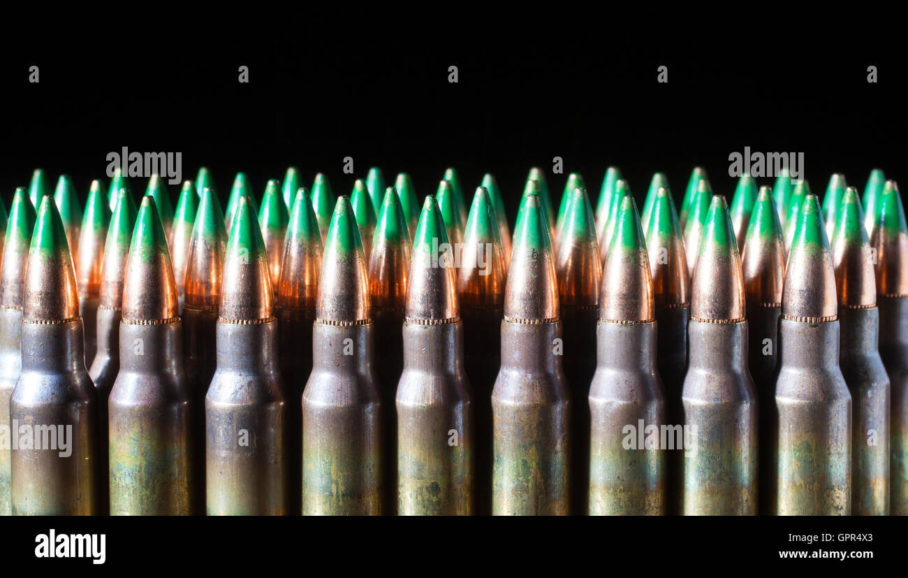 Green tipped bullets that are on rifle cartridges Stock Photo - Alamy