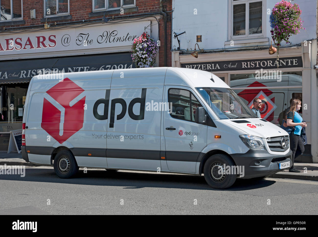 DPD delivery van vehicle delivering in the town city centre York North ...