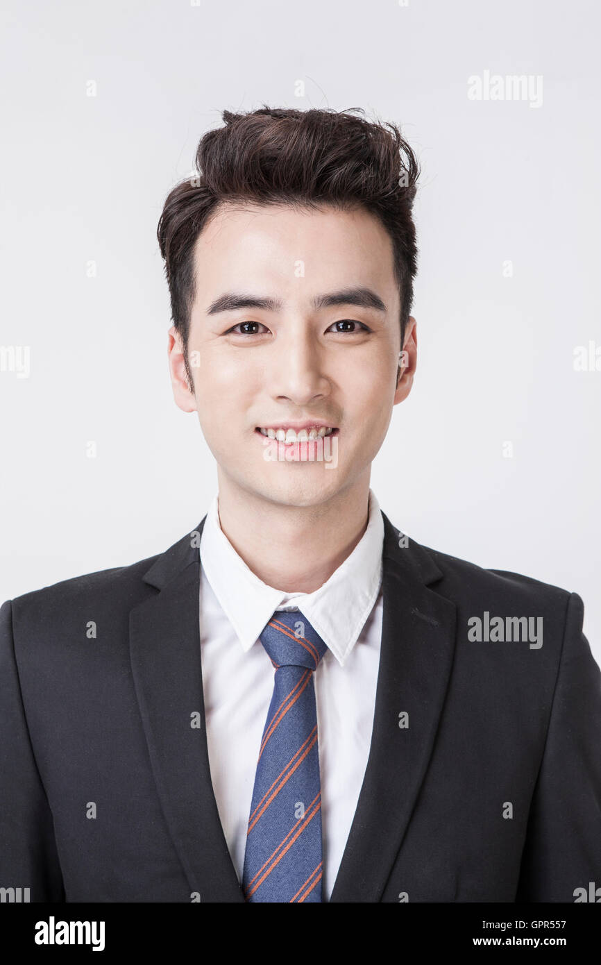 Portrait of young smiling businessman Stock Photo - Alamy