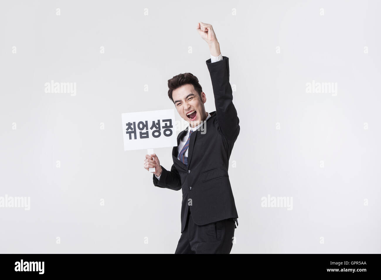 Young businessman succeeding in finding job Stock Photo - Alamy