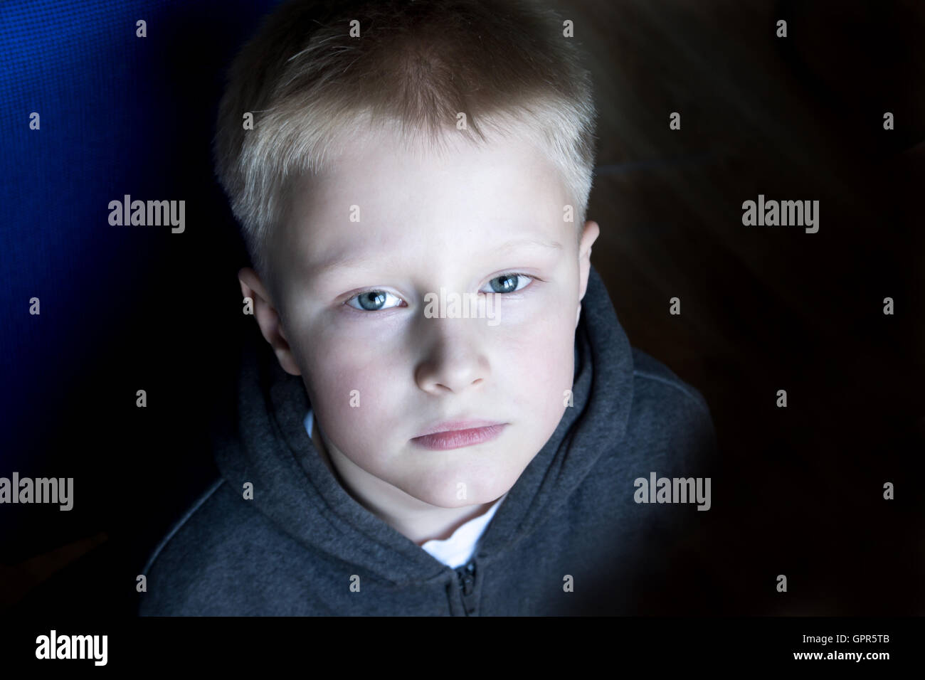 Sad upset waiting boring depressed child (boy, teen) with grey eyes ...