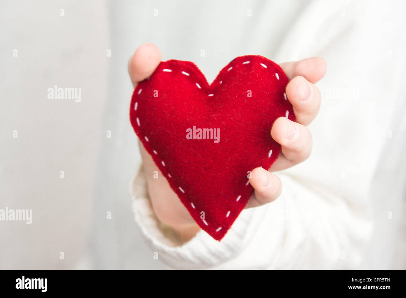 Girl hand over heart hi-res stock photography and images - Alamy