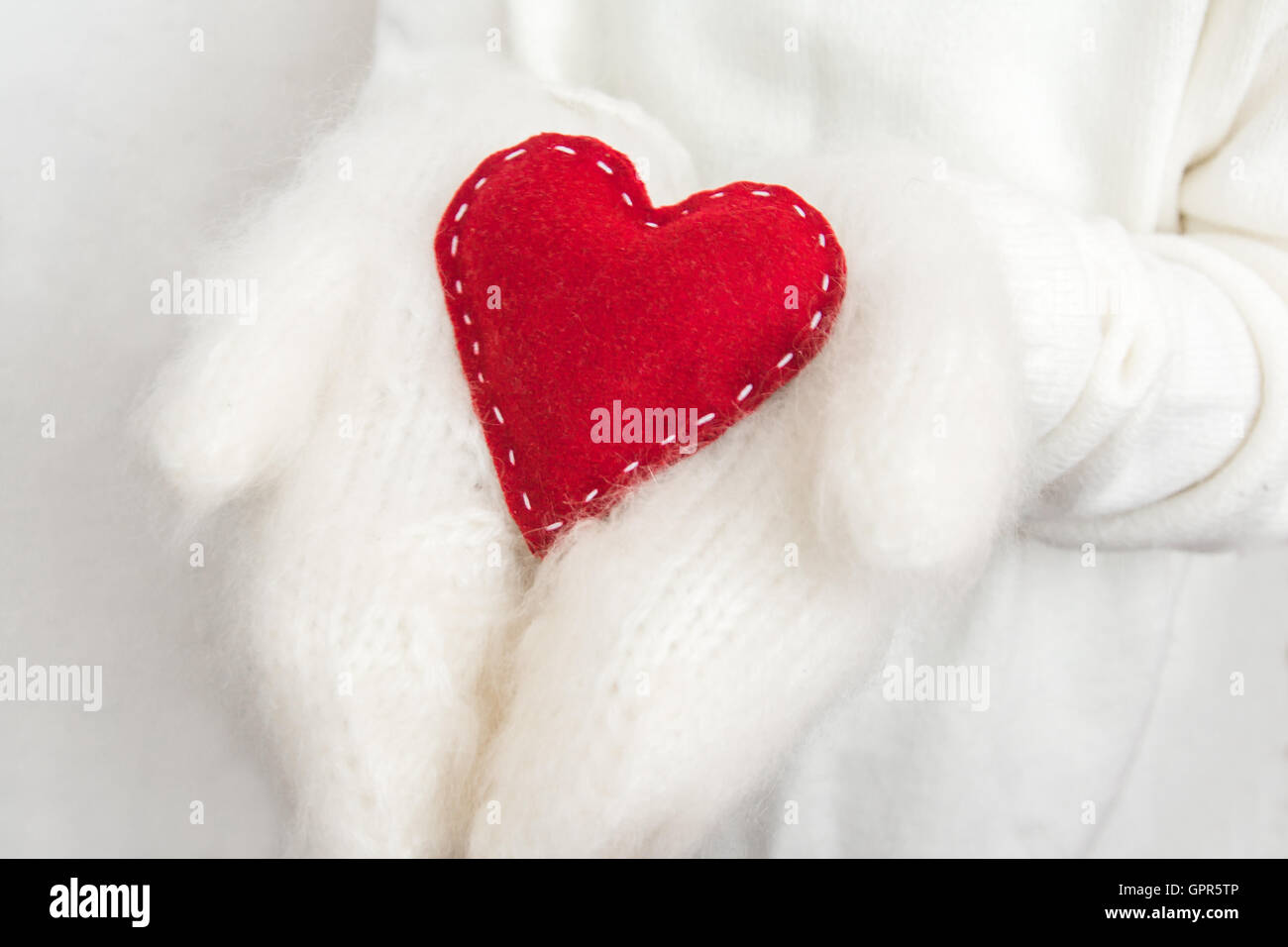 Woman hands in knitted mittens hi-res stock photography and images - Alamy