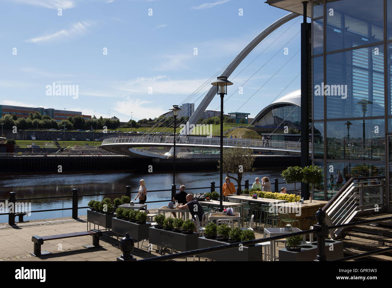 A close up of a cafe with the Millennium Bridge in the background Stock ...