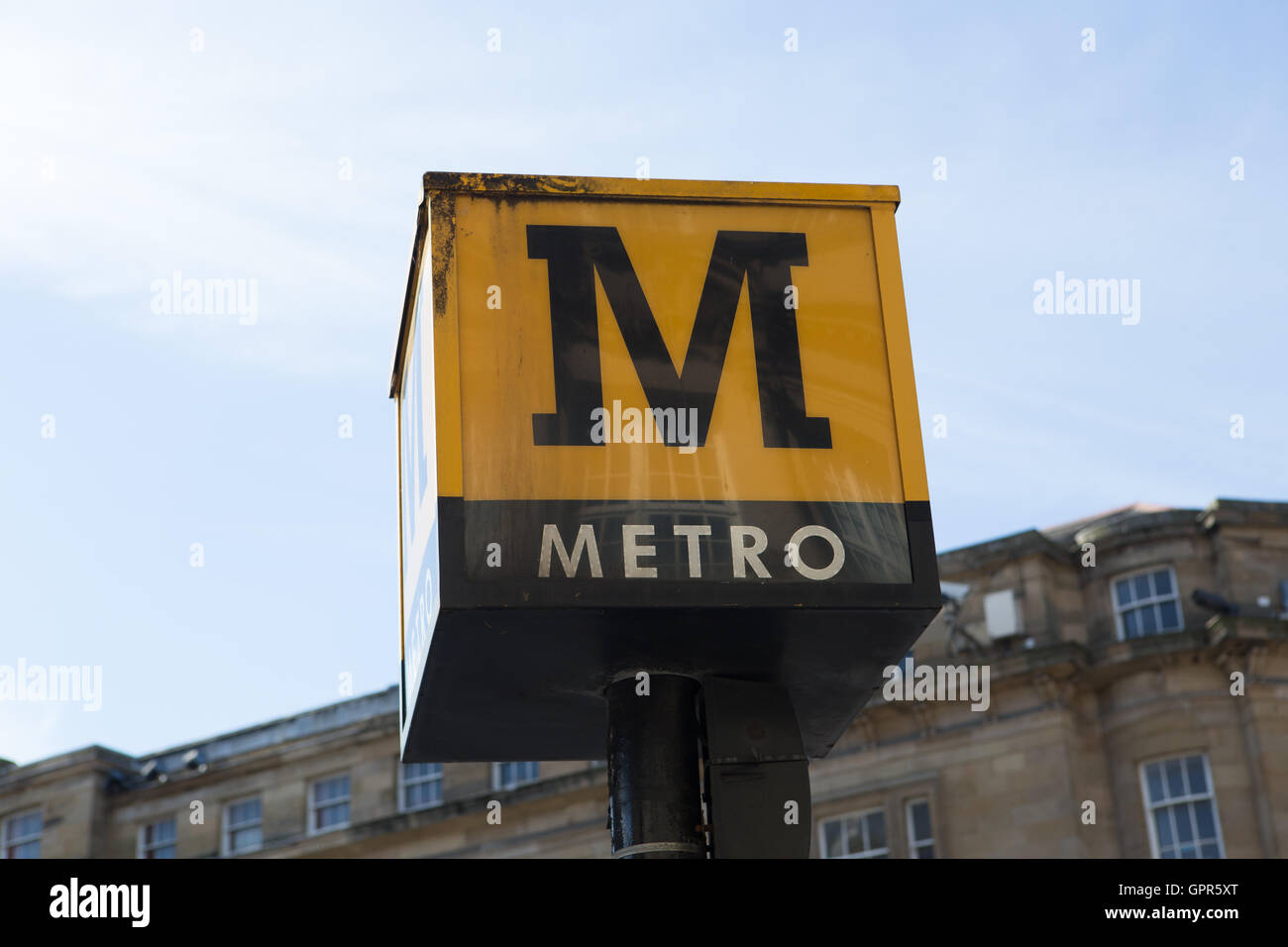 Metro Sign with the sun shinning down on it Stock Photo - Alamy