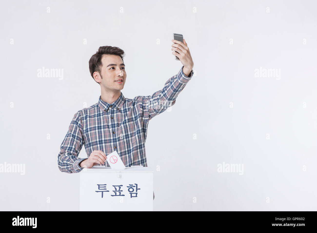 Young male voter taking selfie Stock Photo - Alamy