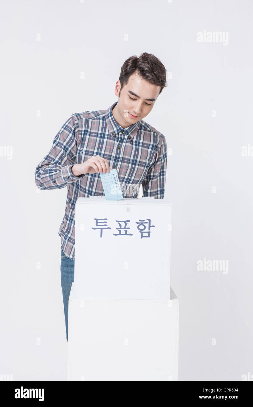 Young man taking a vote Stock Photo - Alamy