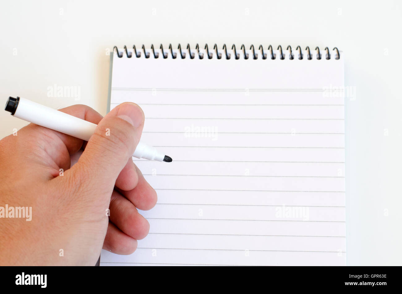 Human hand and notepad over white background Stock Photo - Alamy