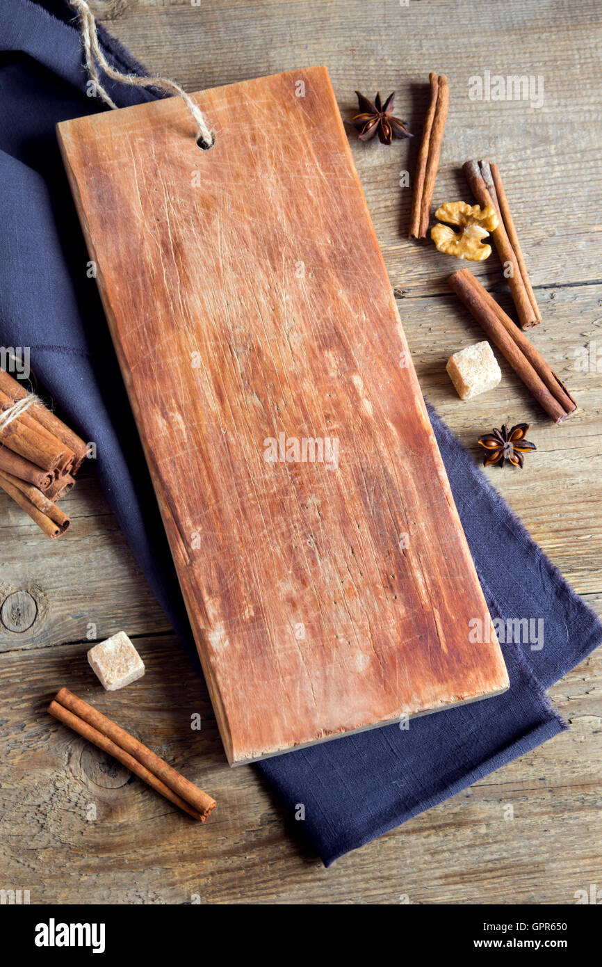 Empty rustic wooden cutting board with baking ingredients, homemade ...