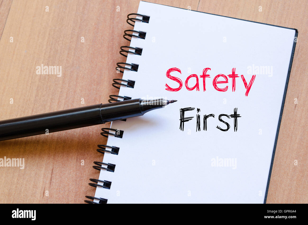 Safety first text concept write on notebook Stock Photo - Alamy