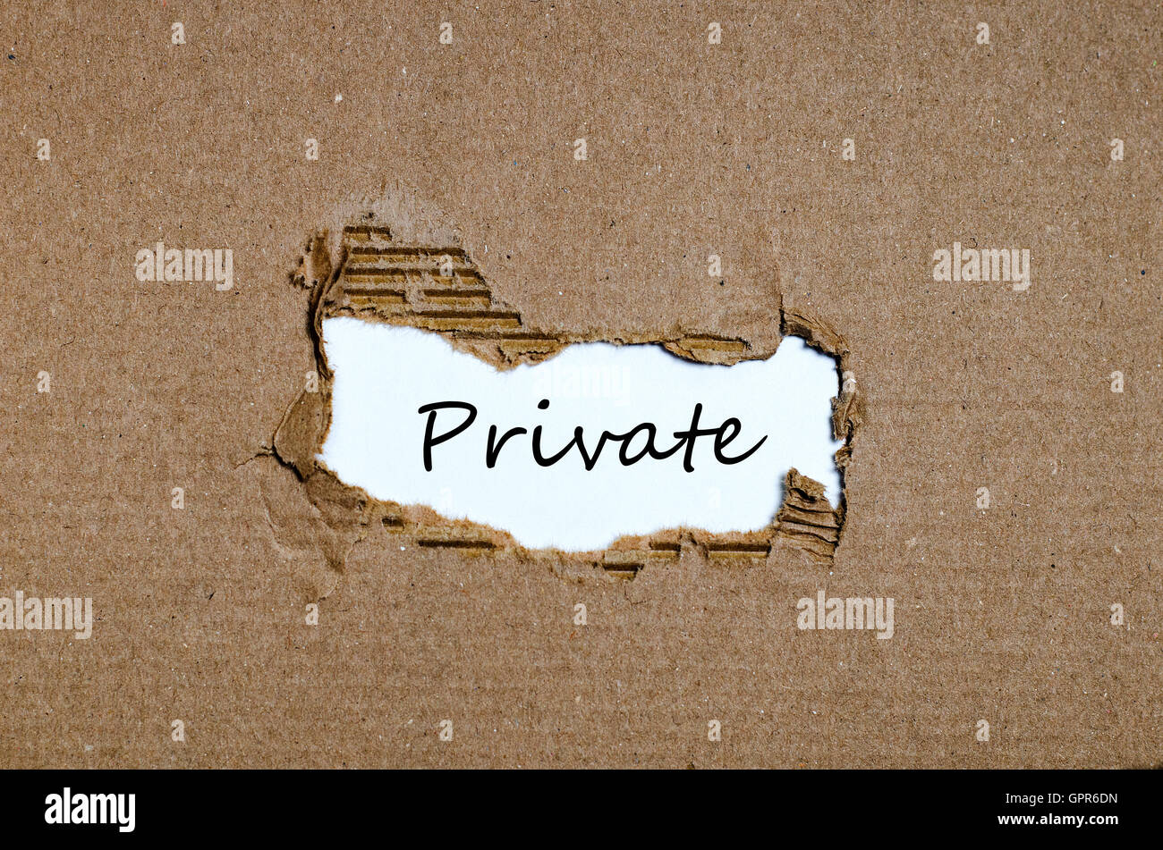 The word private appearing behind torn paper Stock Photo - Alamy
