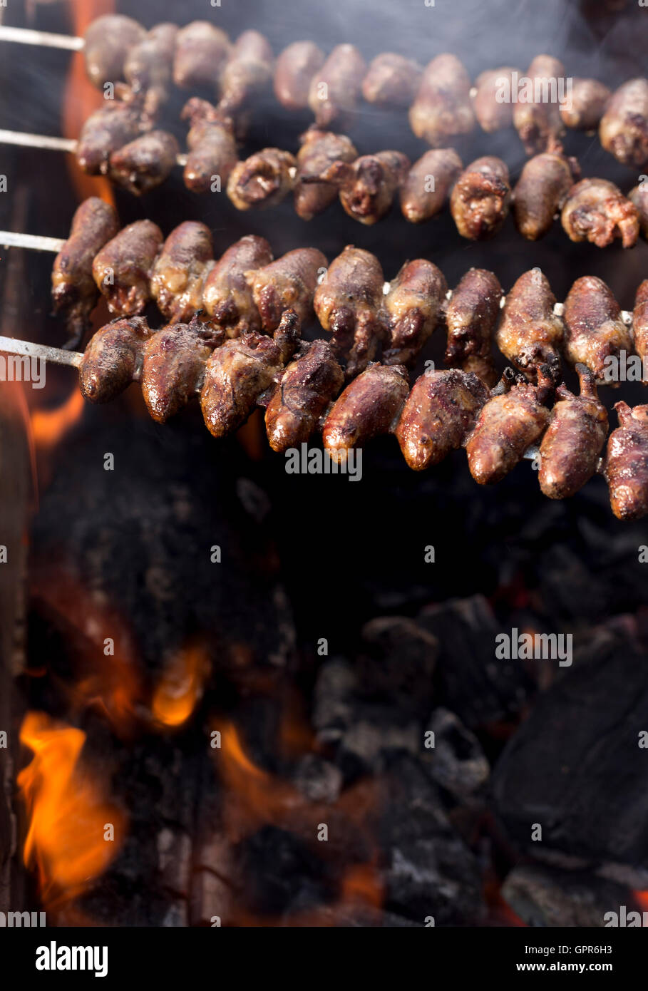 Churrasco, traditional Brazilian barbecue, chicken hearts grilled ...