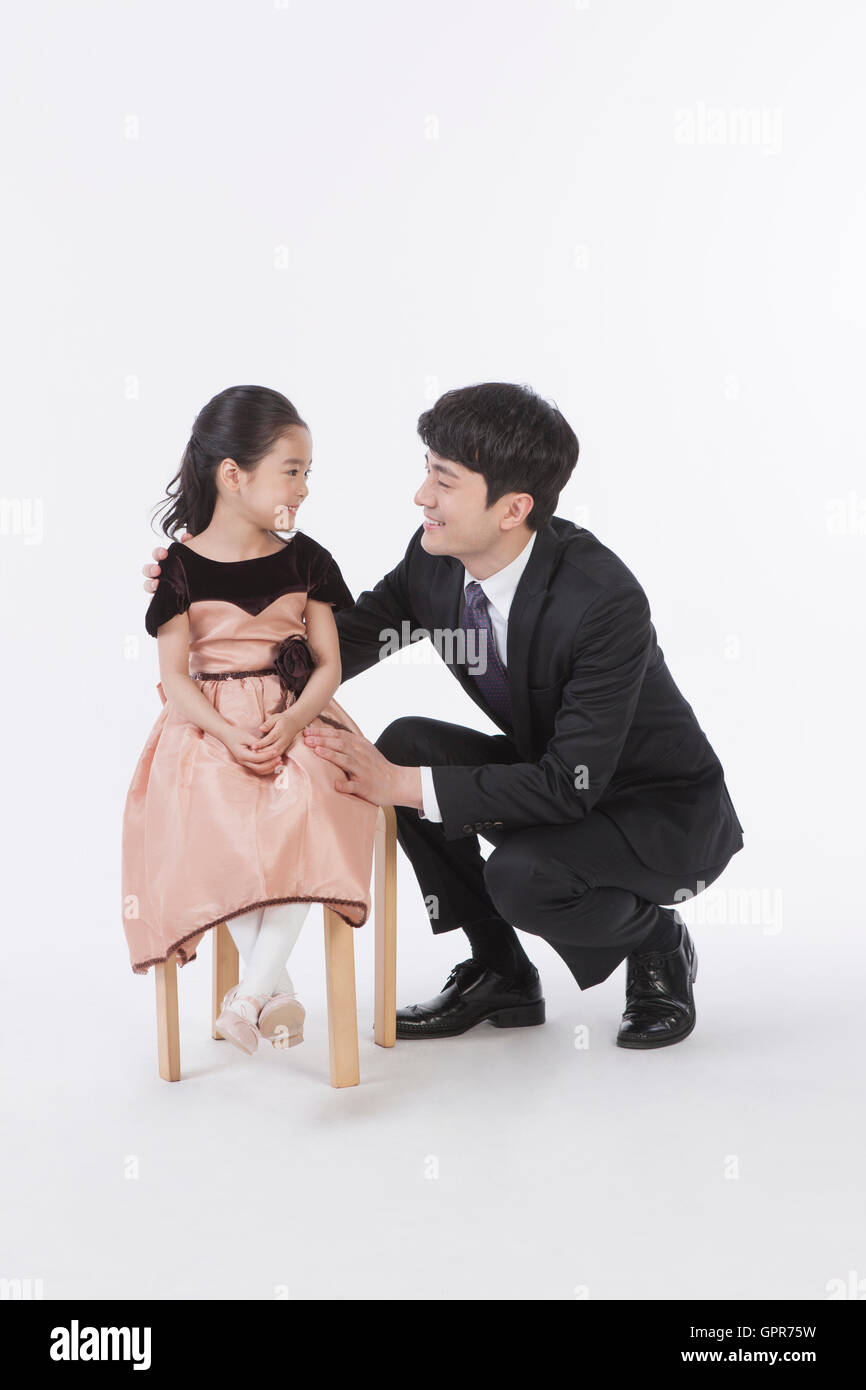 Smiling daughter and father face to face Stock Photo - Alamy