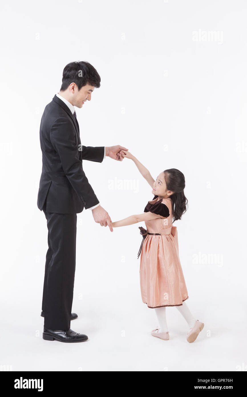 Smiling father and daughter dancing Stock Photo - Alamy