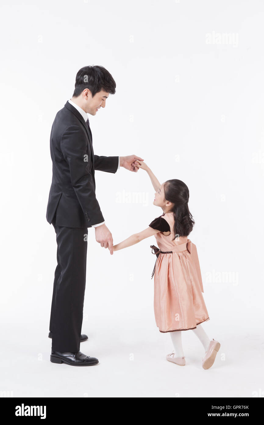 Smiling father and daughter dancing Stock Photo - Alamy