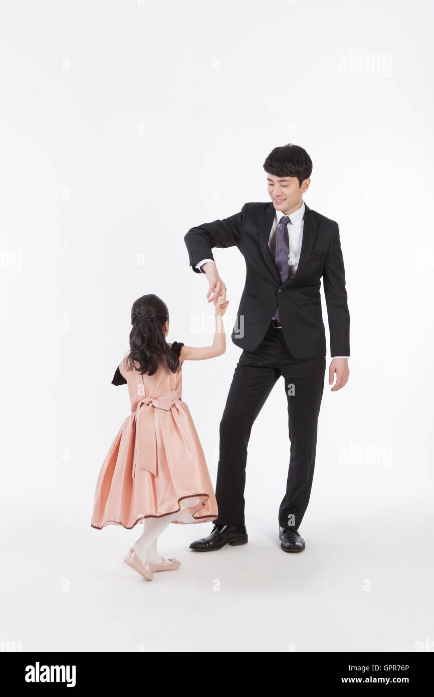Smiling father and daughter dancing Stock Photo - Alamy