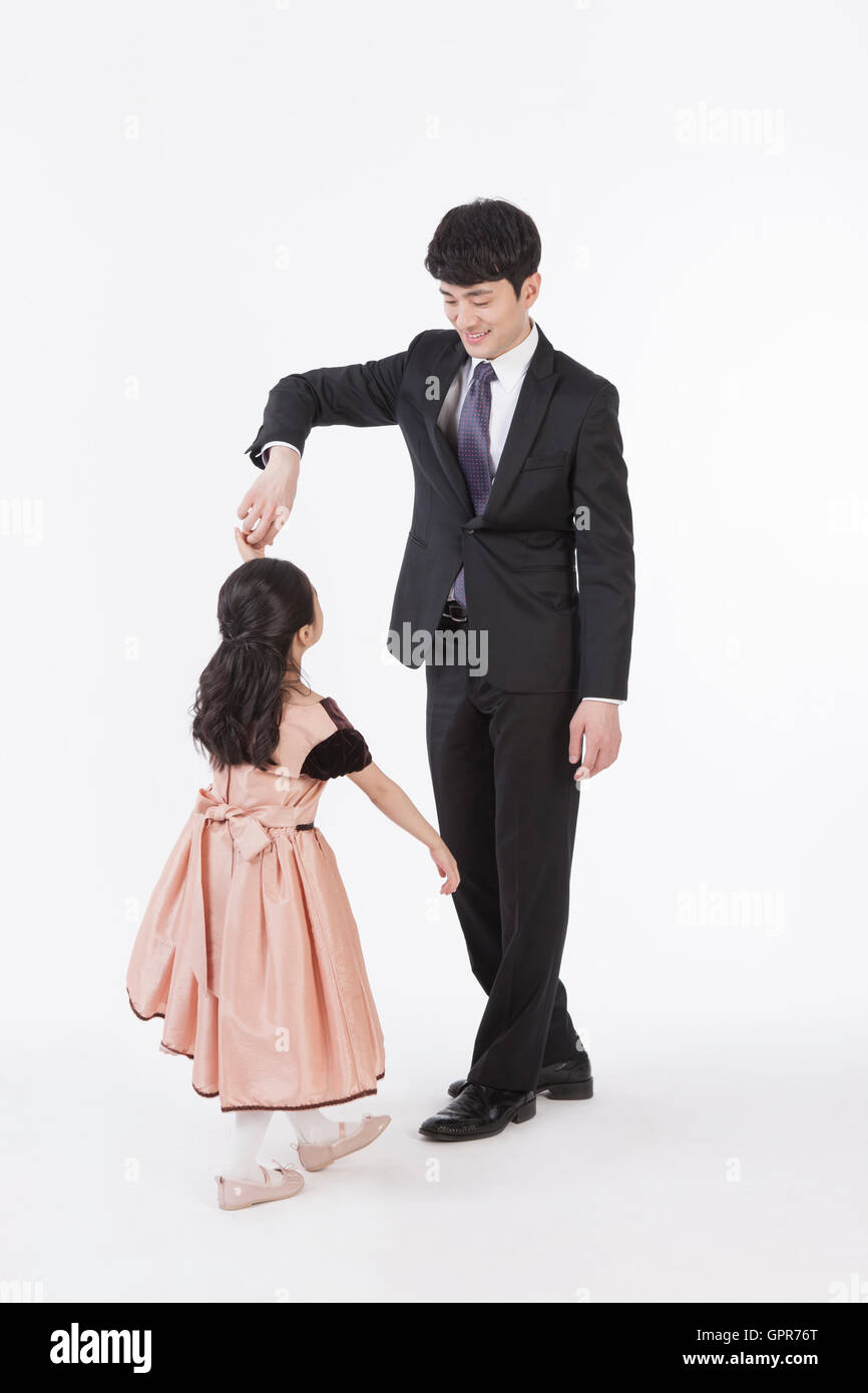 Smiling father and daughter dancing Stock Photo - Alamy