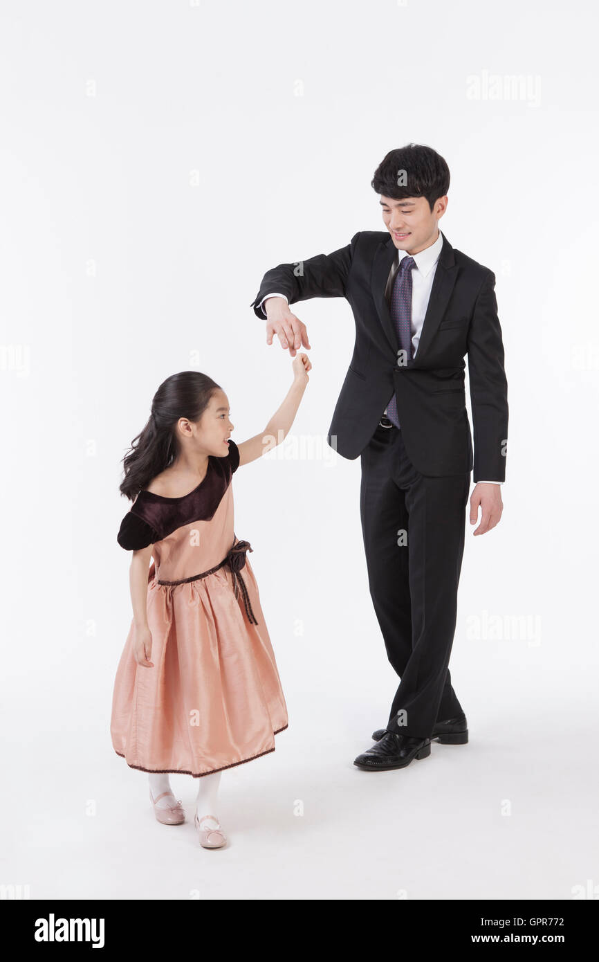 Smiling father and daughter dancing Stock Photo - Alamy