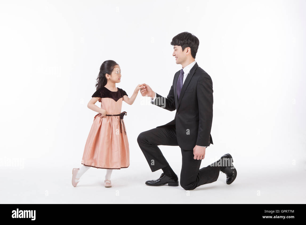 Smiling father and daughter face to face Stock Photo - Alamy