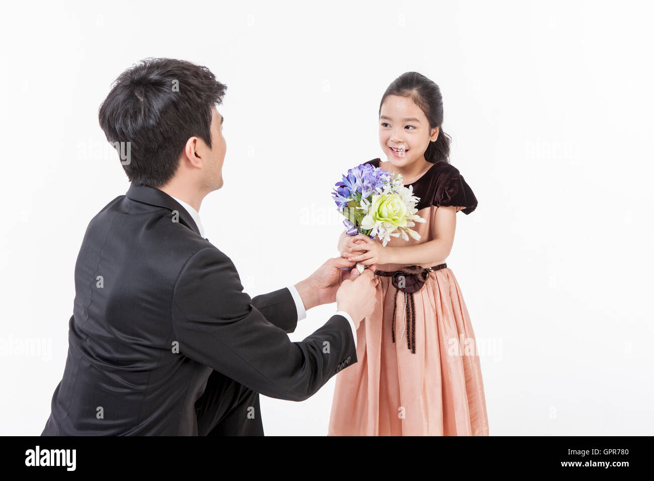 Loving father giving his daughter flowers Stock Photo - Alamy