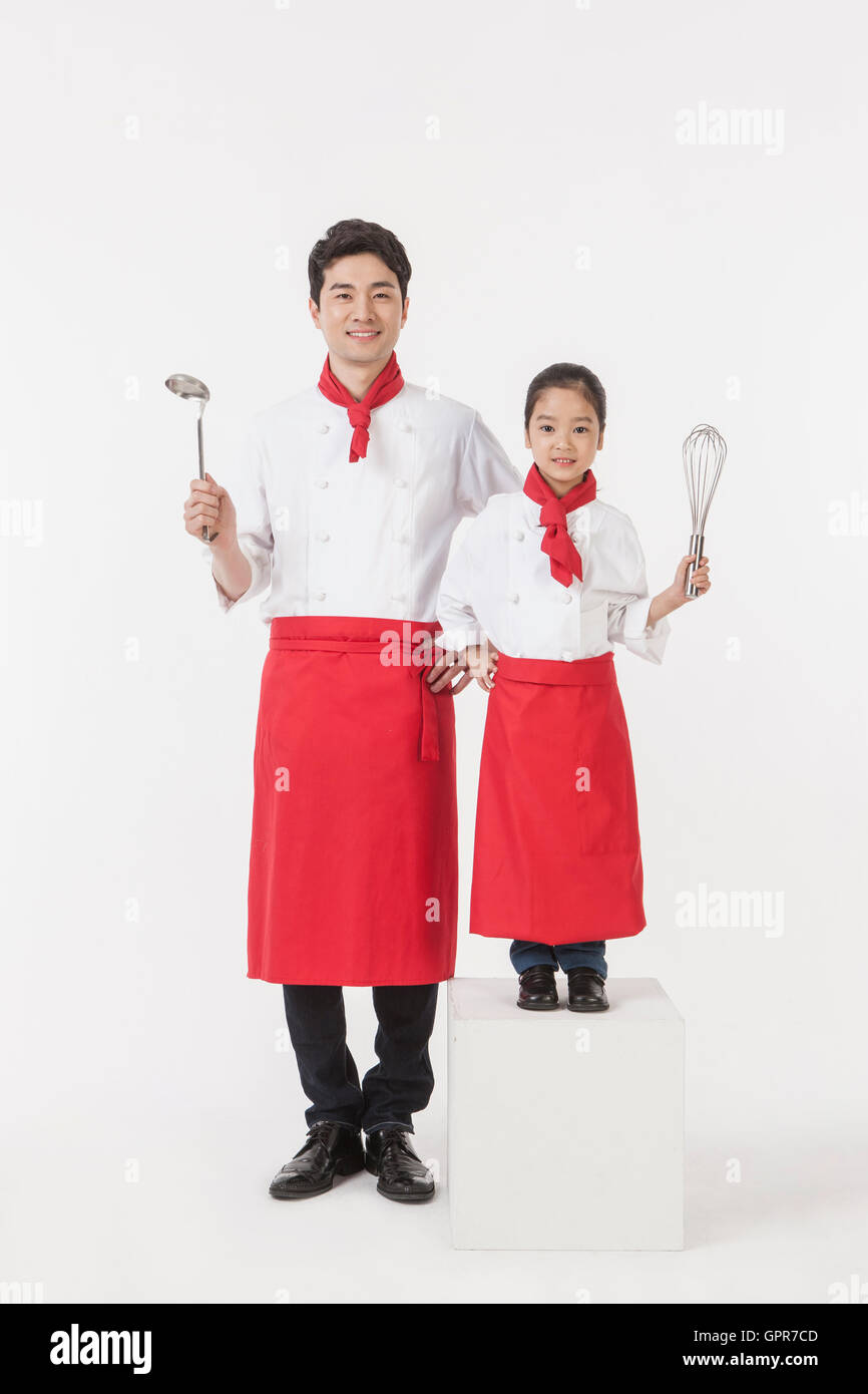 Smiling cook and his daughter Stock Photo - Alamy