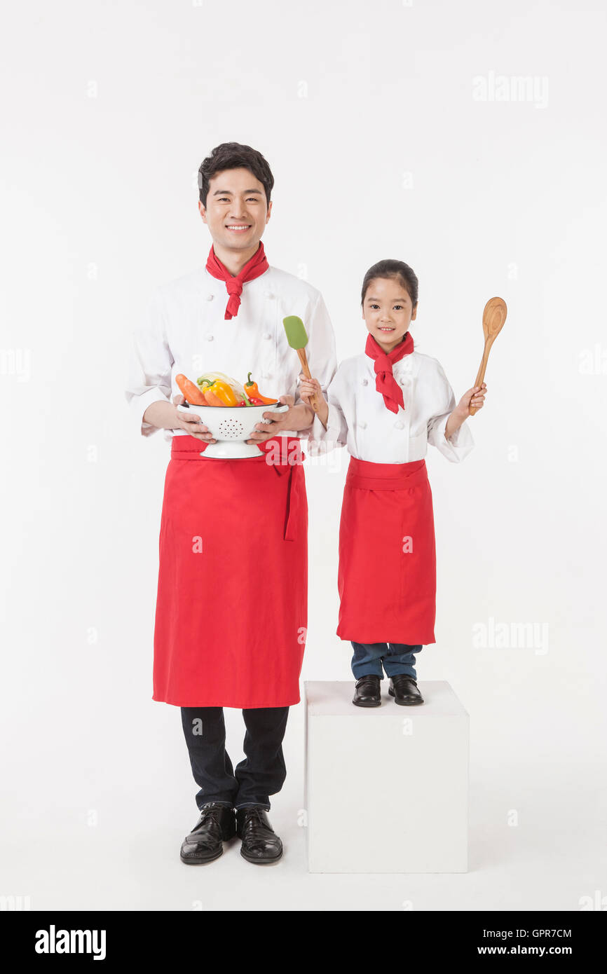 Smiling cook and his daughter Stock Photo - Alamy