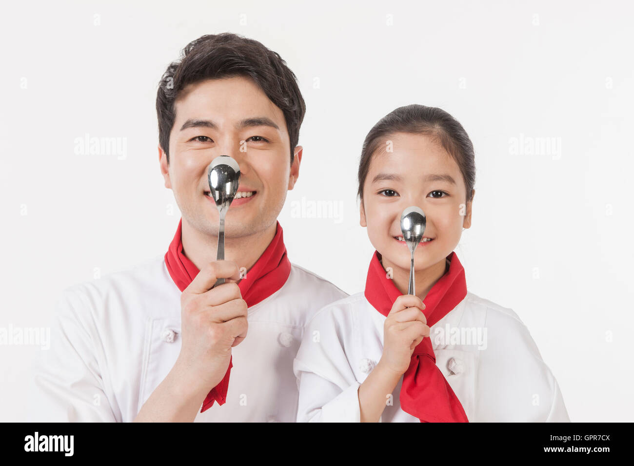 Smiling cook and his daughter Stock Photo - Alamy