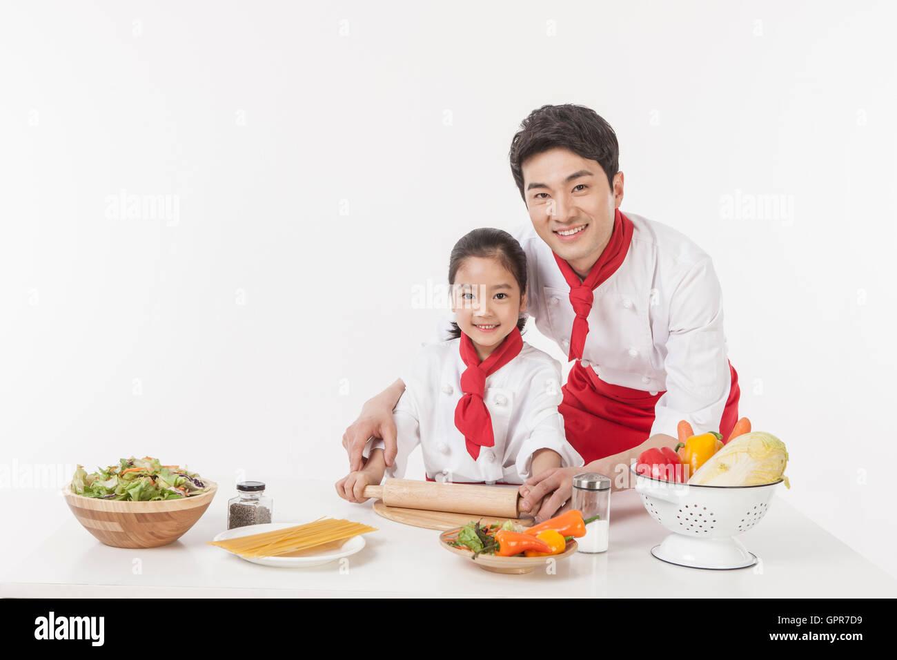 Smiling father daughter cooking hi-res stock photography and images - Alamy