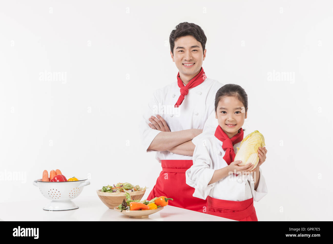 Smiling cook and his daughter Stock Photo - Alamy
