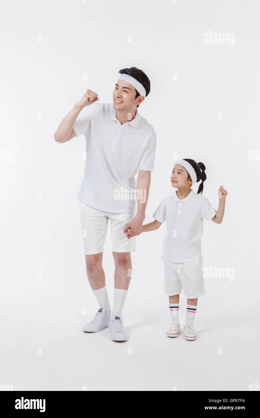 Father and daughter cheering hand in hand Stock Photo - Alamy