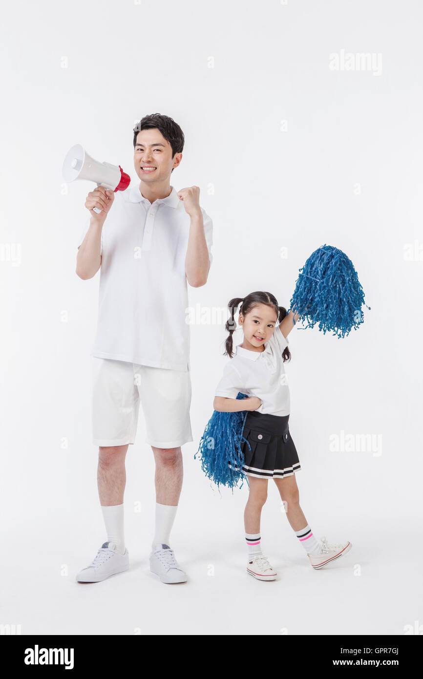 Harmonious father and daughter cheering Stock Photo - Alamy