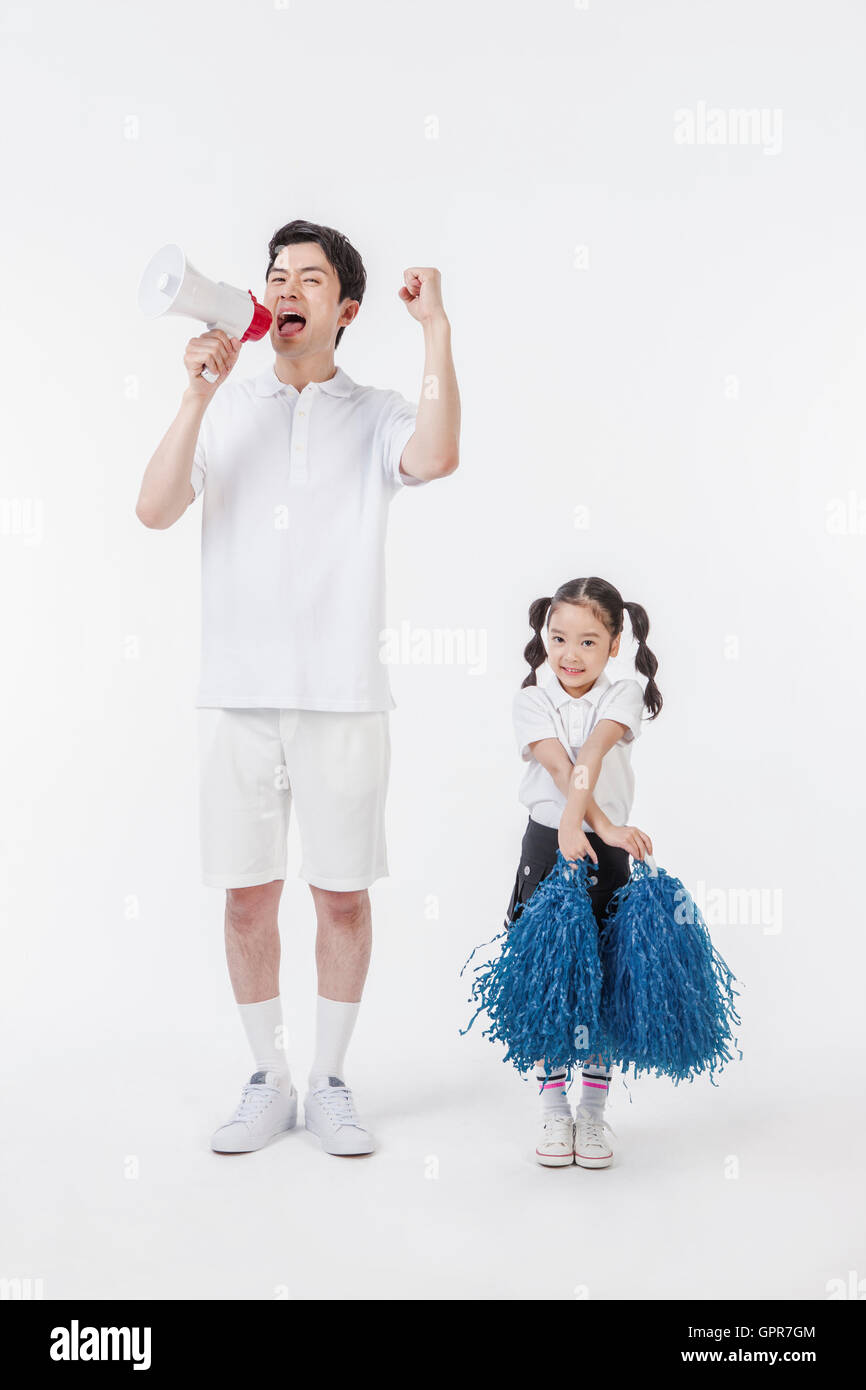 Harmonious father and daughter cheering Stock Photo - Alamy