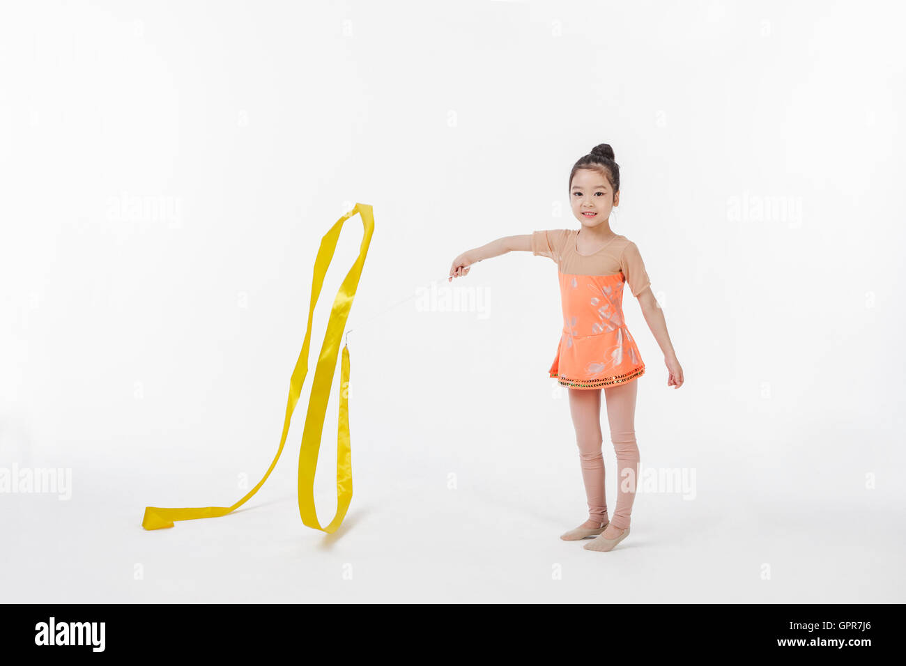 Girl playing rhythmic gymnastics Stock Photo - Alamy
