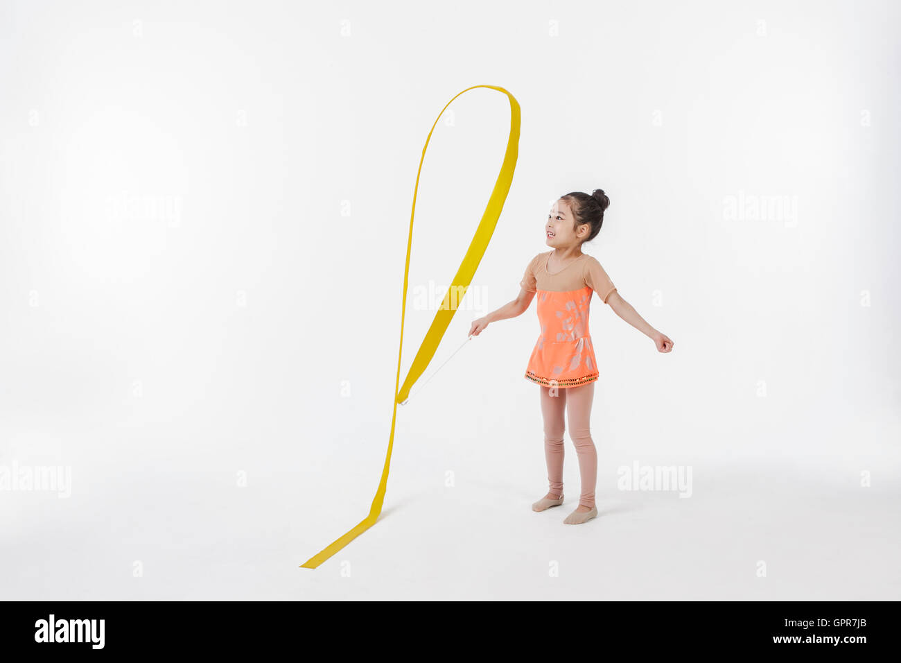 Girl playing rhythmic gymnastics Stock Photo - Alamy