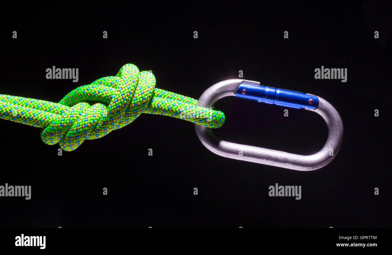 Rope tied in a figure eight with a carabiner at the end Stock Photo - Alamy