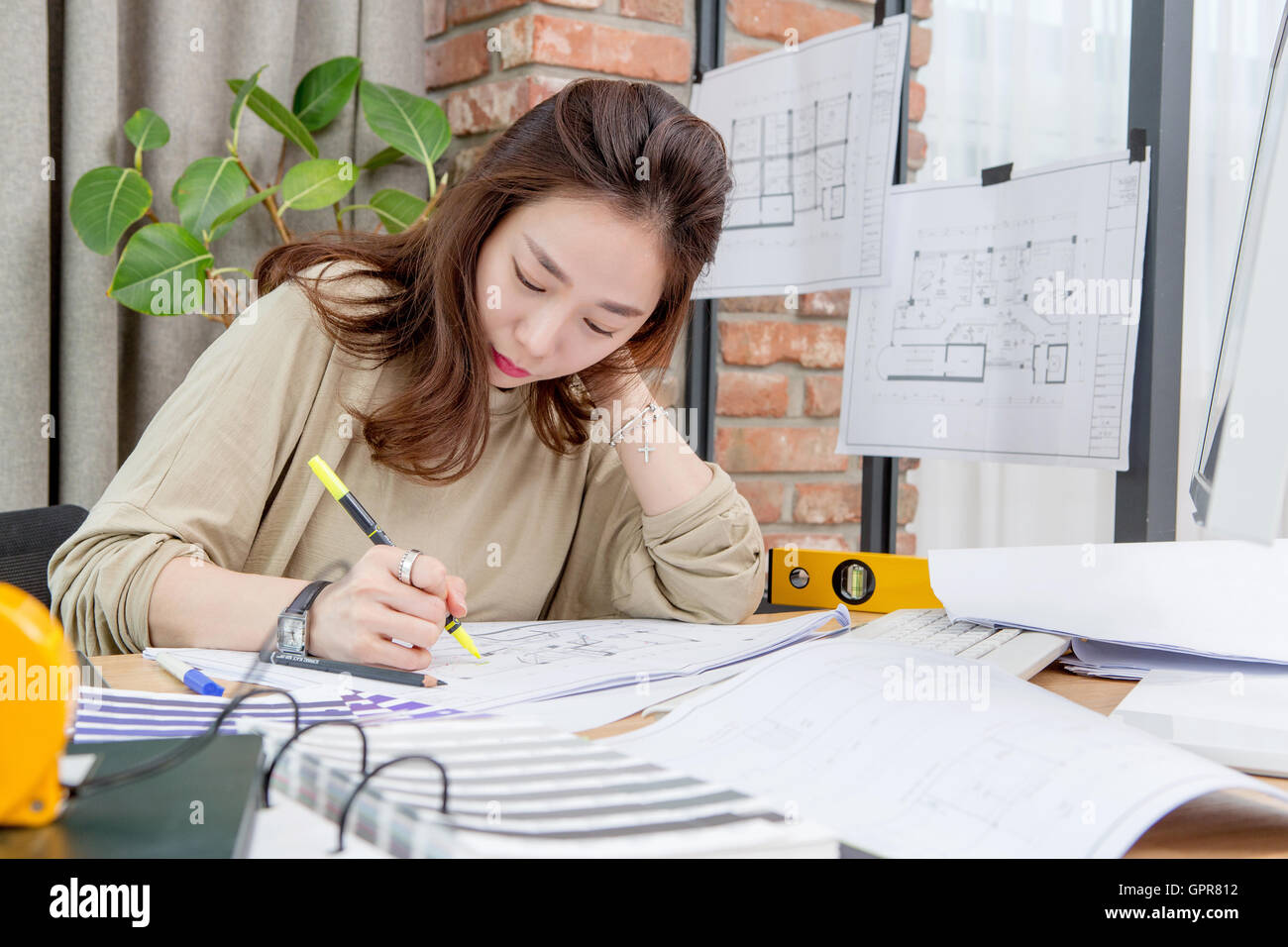 Female interior designer working Stock Photo - Alamy