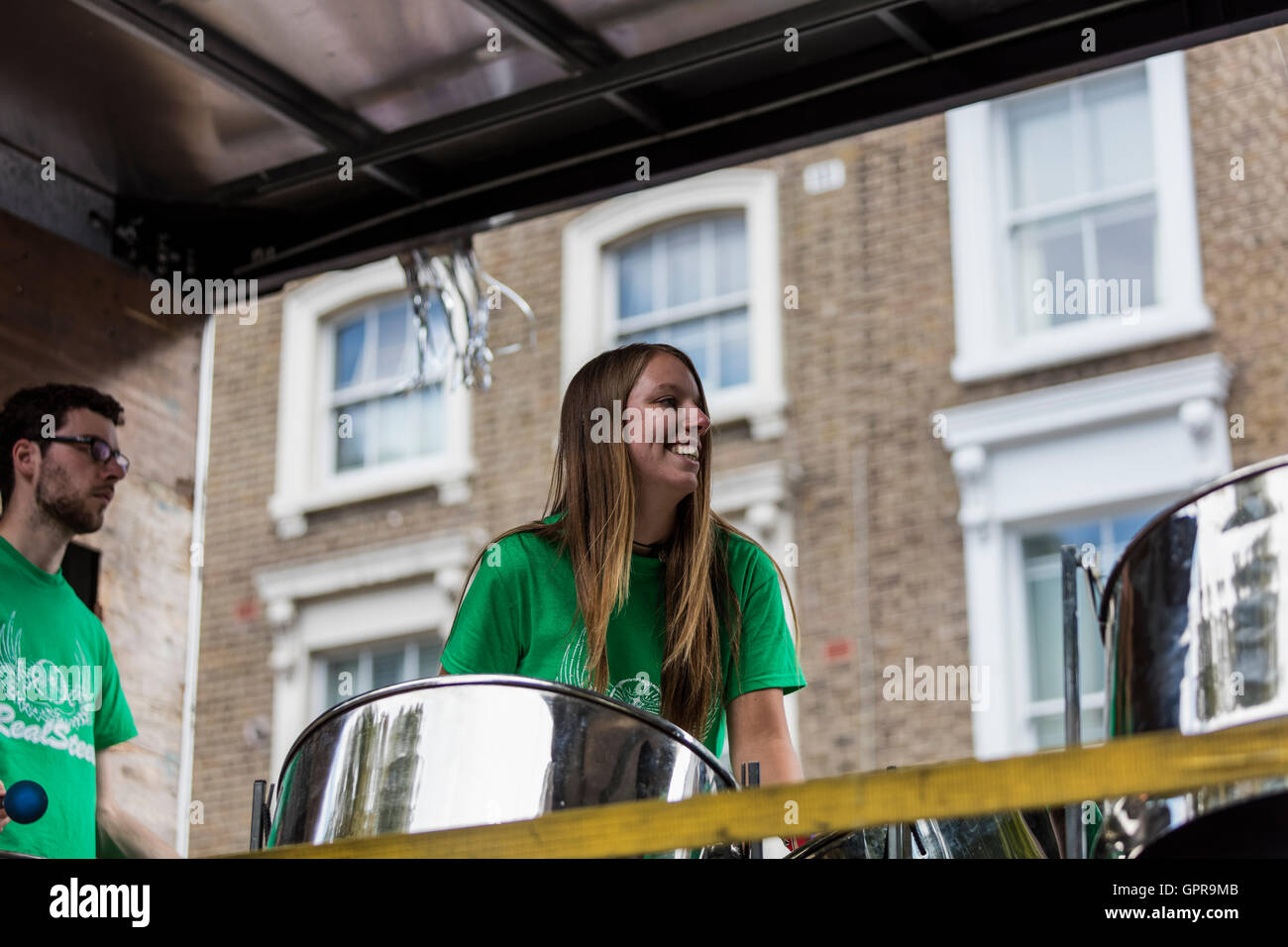 Young white woman with blonde hair in a steel band on a float at the ...