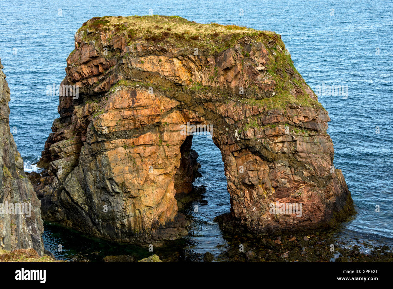 A rock arch at the foot of Glen Shellesder, Isle of Rum, Scotland, UK ...
