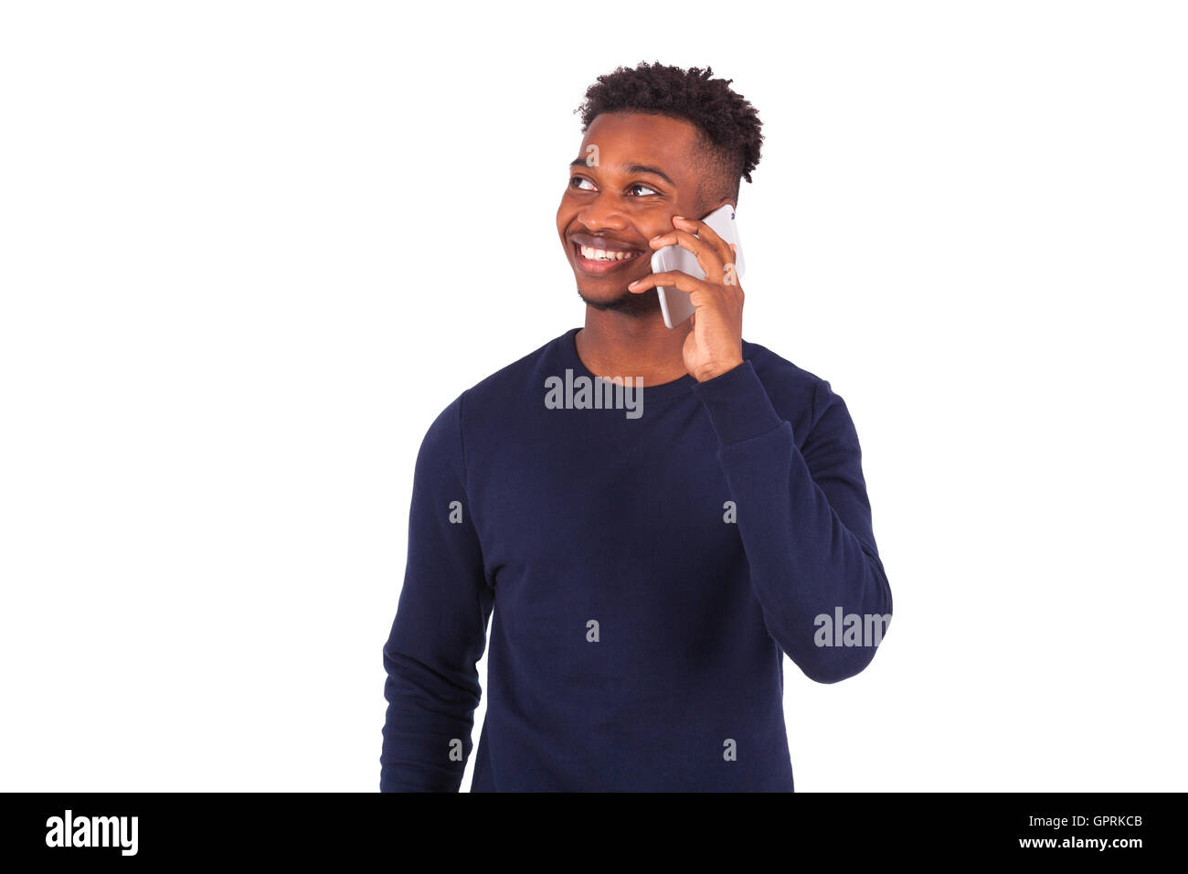 Young African American man making a phone call on her smartphone ...