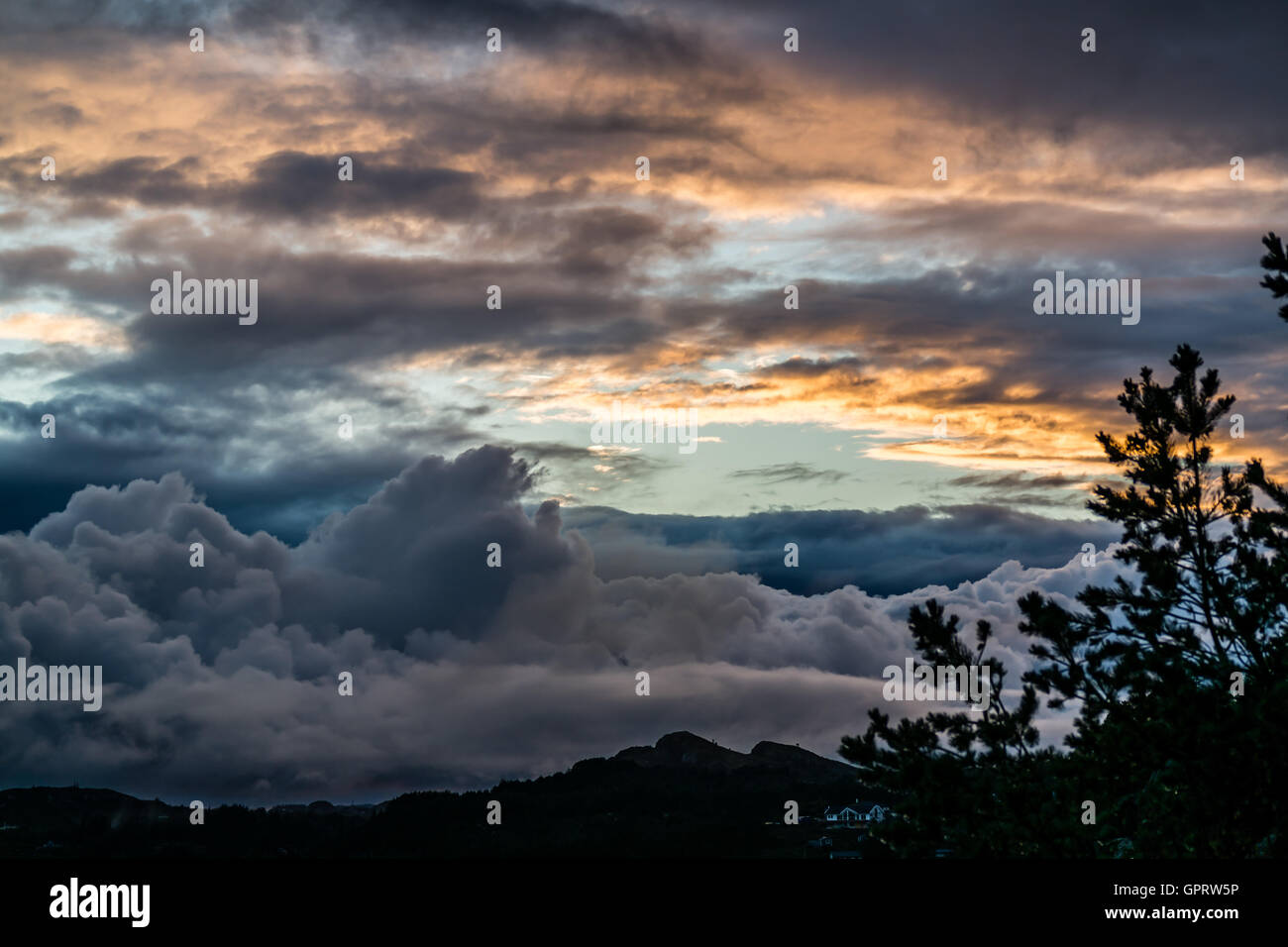 A colorful sunset, with dramatic clouds and high contrast Stock Photo ...