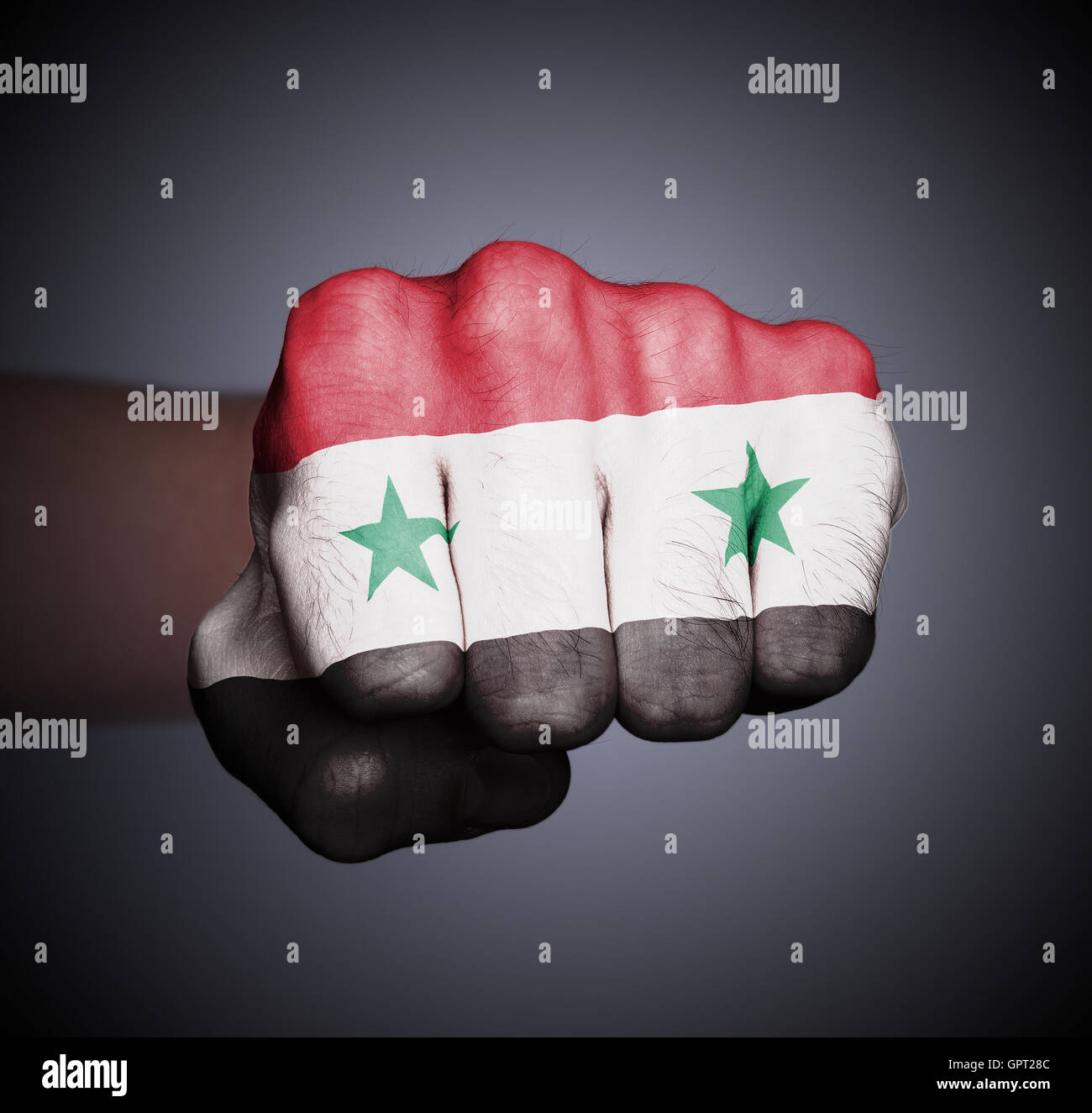 Front view of punching fist on gray background Stock Photo - Alamy